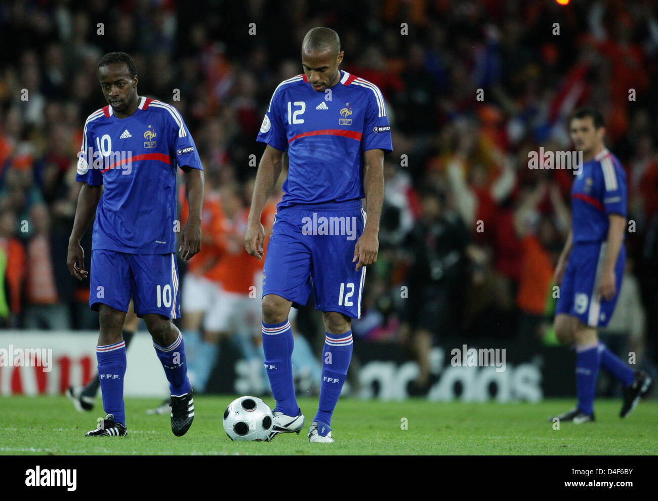 Sidney Govou (L) and Thiery Henry of France react after the 2-0 goal ...
