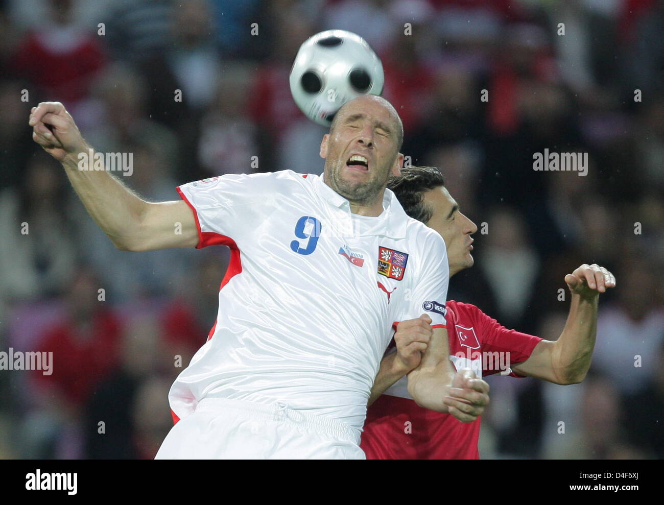 Mehmet Topal (R) of Turkey vies with Jan Koller of Czech Republic ...