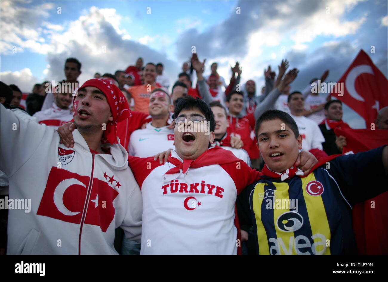 Turkish fans are pictured in front of a video screen prior to the last ...