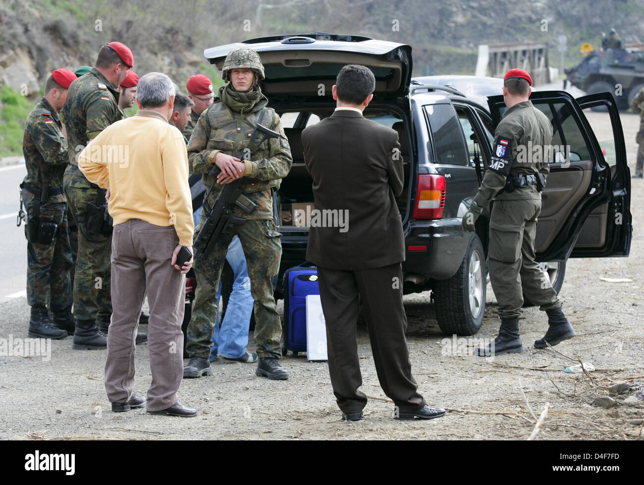German Bundeswehr soldiers check cars and drivers during a road check ...