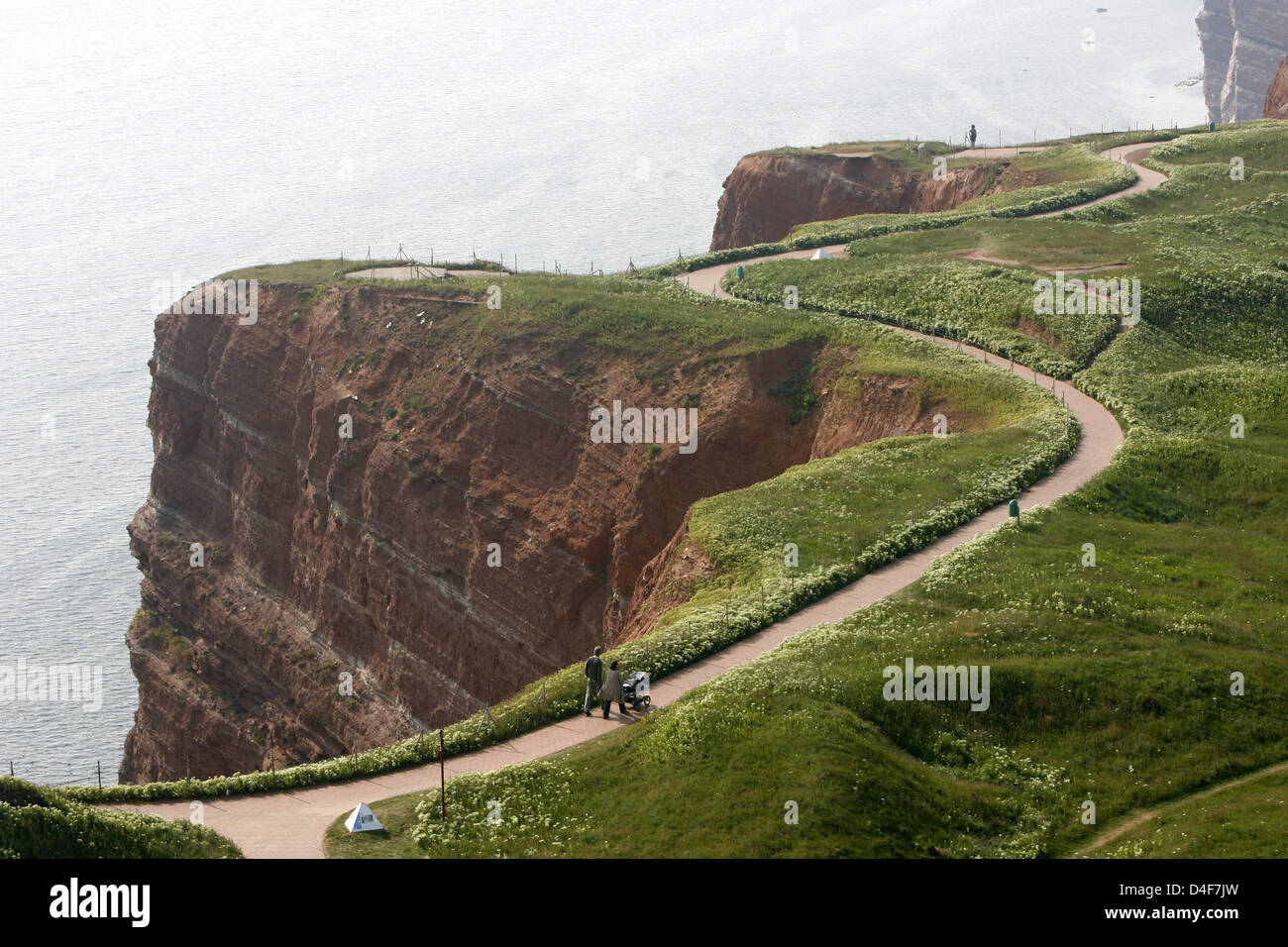 Visitors walk along the cliffs of Helgoland Island, Germany, 31 May ...