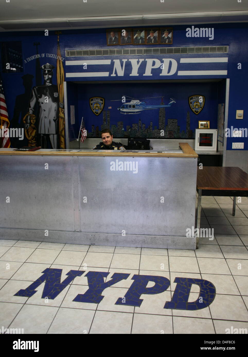 A policeman sits at the New York Police Department (NYPD) office at ...
