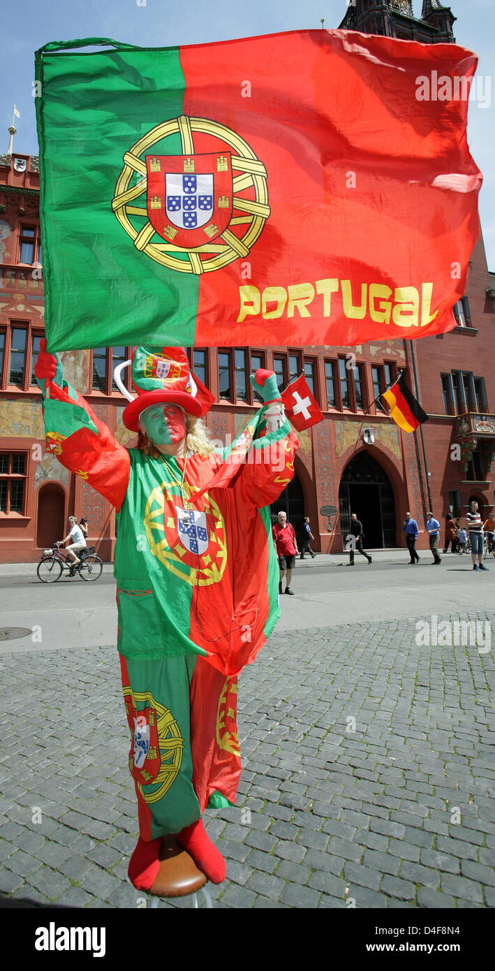 A Supporter of Portugal, dressed in suit made of portuguese flags, seen ...