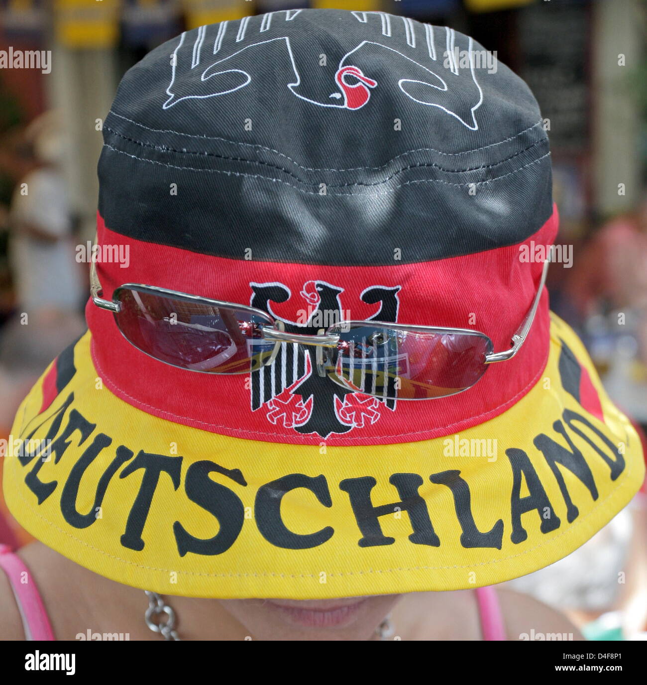 A female German Supporter wearing a hat with "Deutschland" written on ...