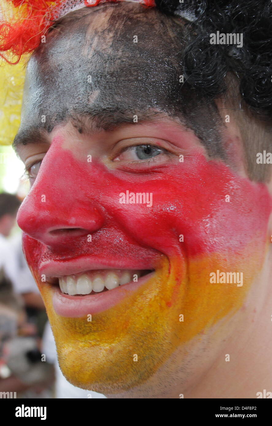 A German supporter with paint on his face, seen downtown Basel prior to ...