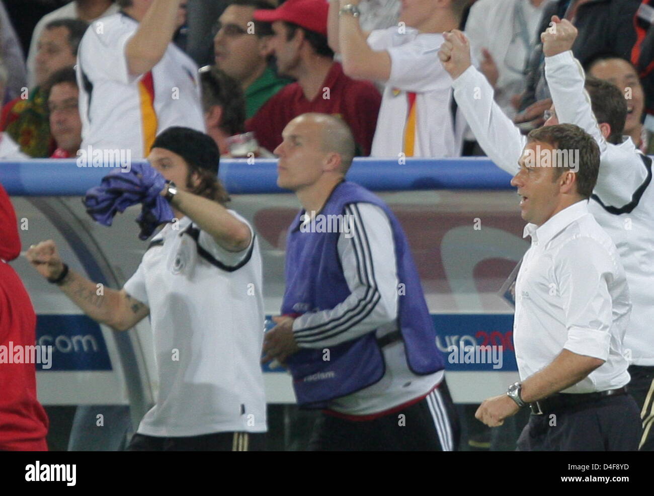 Assistant coach Hansi Flick (R) of Germany jubilates with Torsten ...