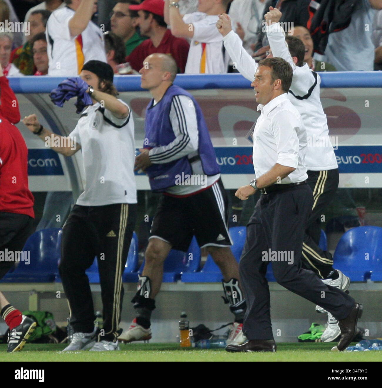 Assistant coach Hansi Flick (C) of Germany jubilates after the 1-3 goal ...