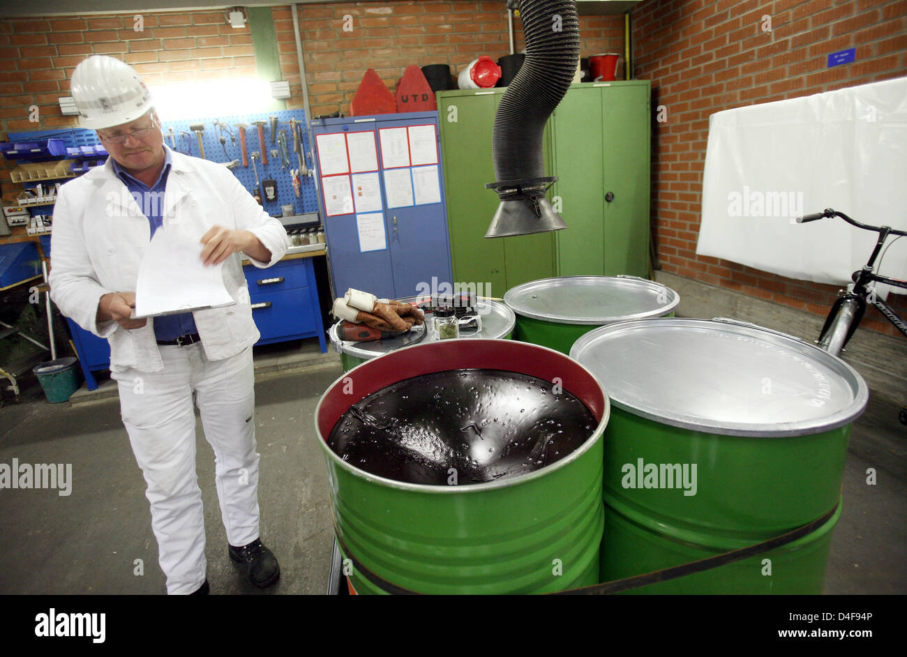 A staff member of the subsurface hazardous waste repository Herfa ...