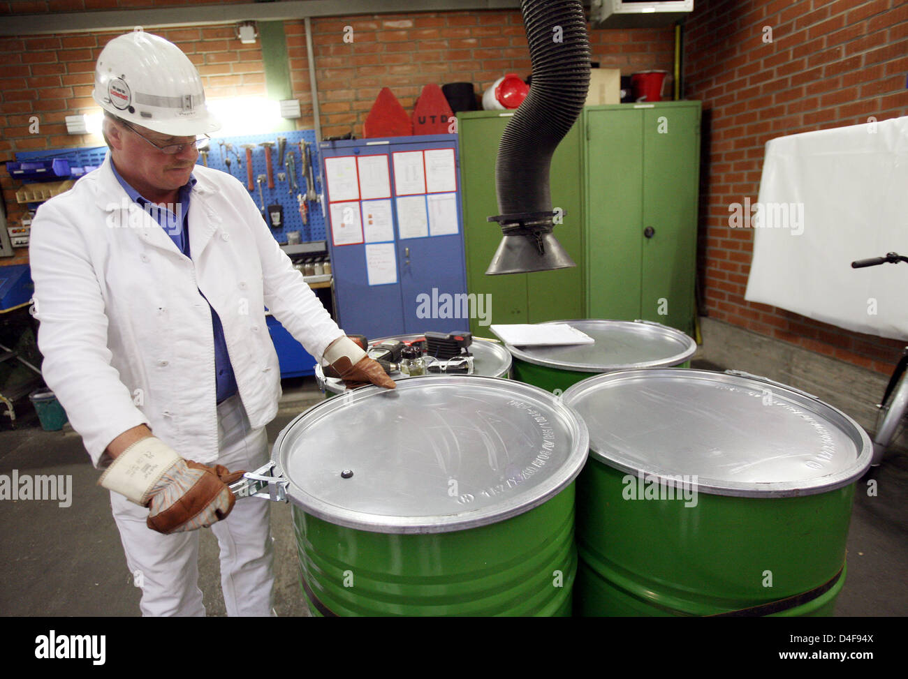 A staff member of the subsurface hazardous waste repository Herfa ...