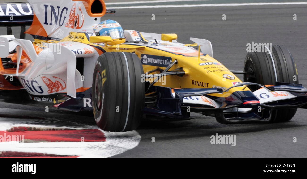 Spanish Formula One driver Fernando Alonso of Renault steers his car ...