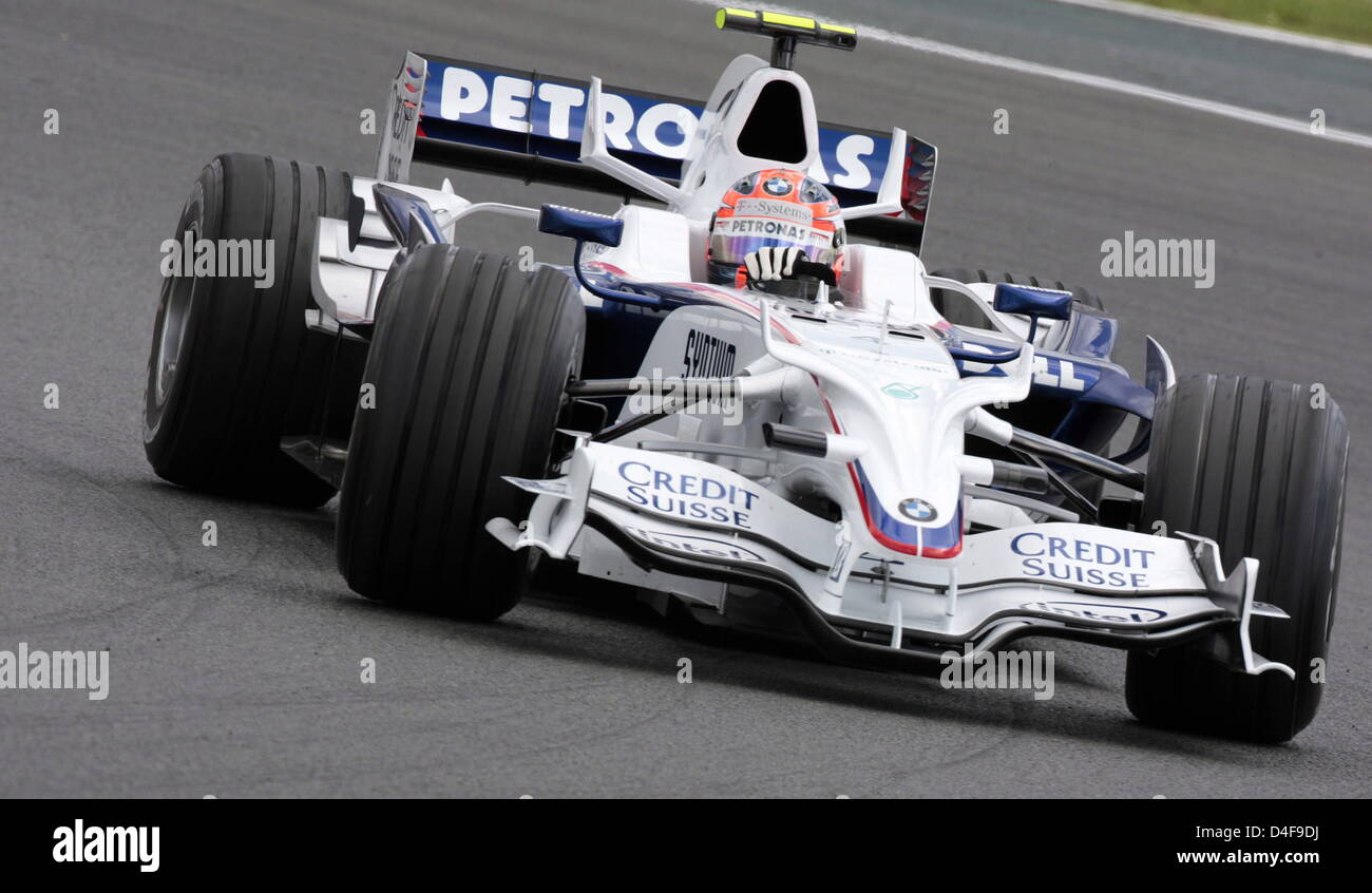 Polish Formula One driver Robert Kubica of BMW Sauber steers his car ...