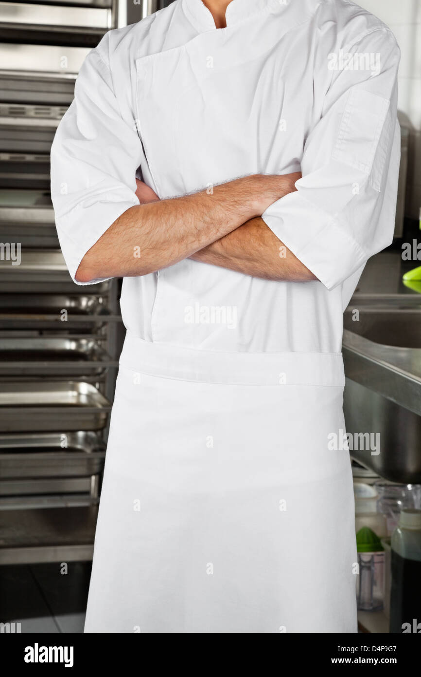 Male Chef Standing With Arms Crossed Stock Photo - Alamy