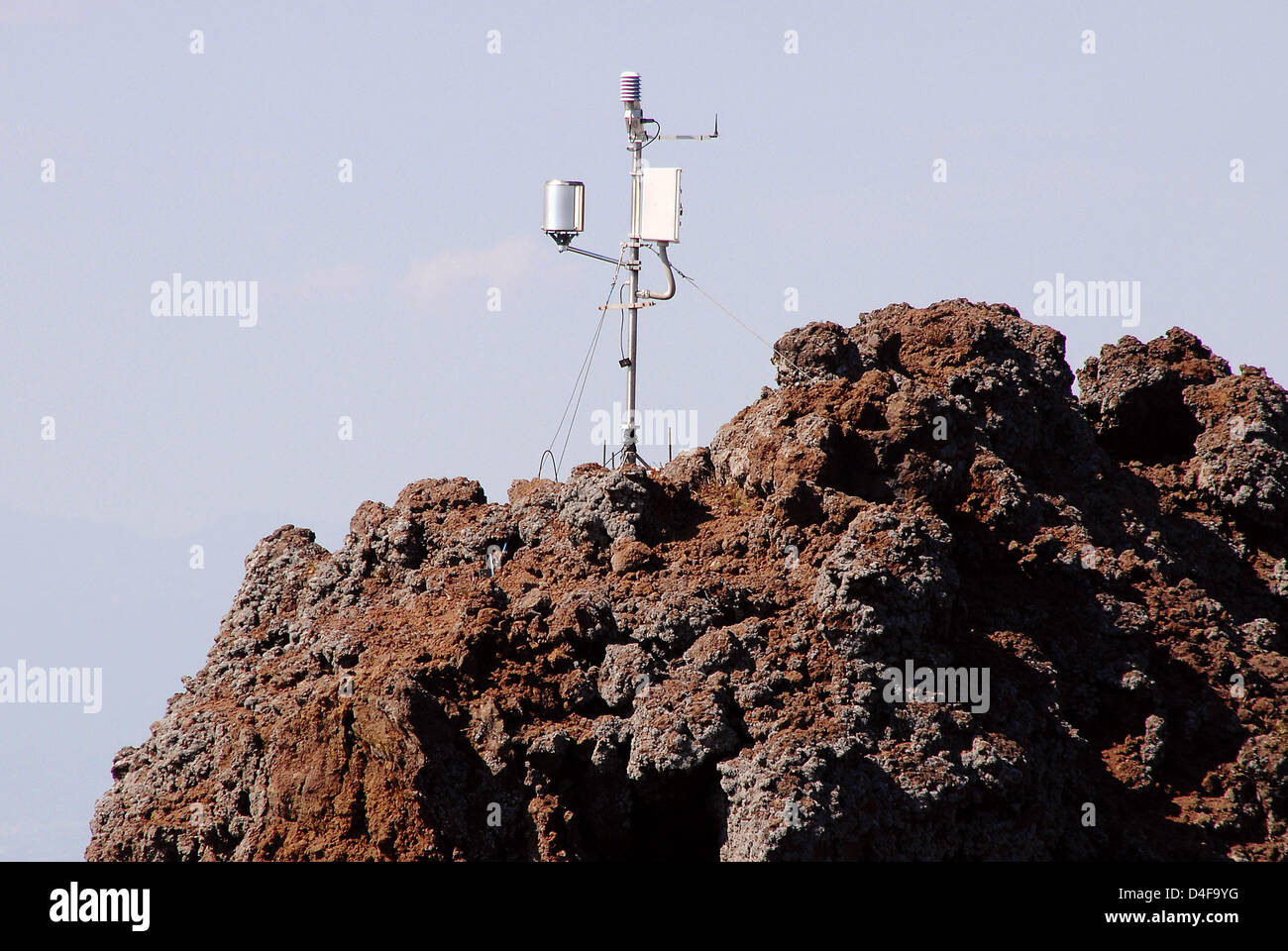 A volcanological measuring device is pictured on ferreous slag which ...