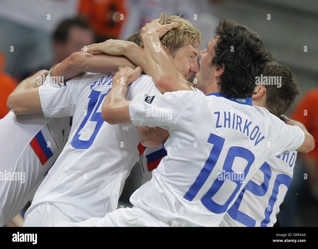 Roman Pavlyuchenko (L) of Russia jubilates with his teammates after his ...