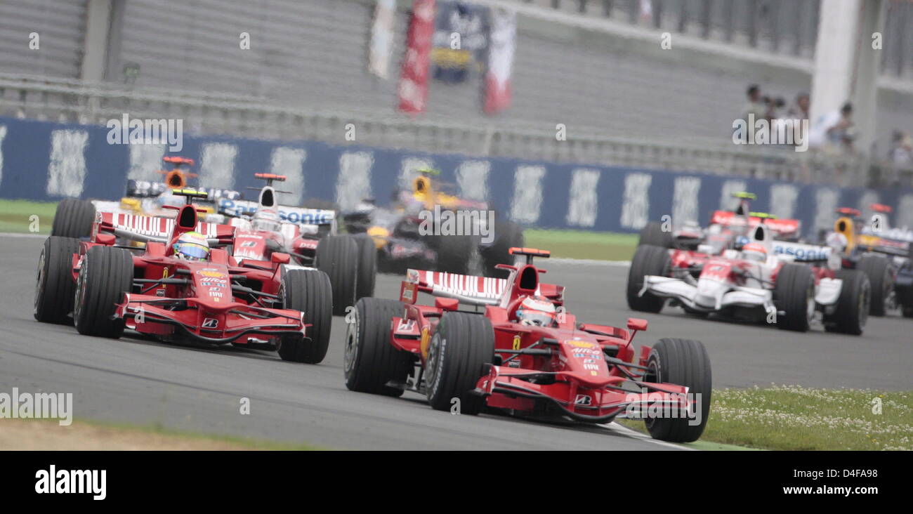 Finnish Formula One driver Kimi Raikkonen of Ferrari leads the pack ...