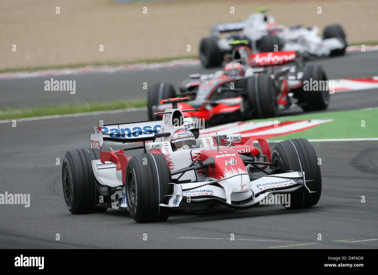 Italian Formula One driver Jarno Trulli of Toyota leads in front of ...
