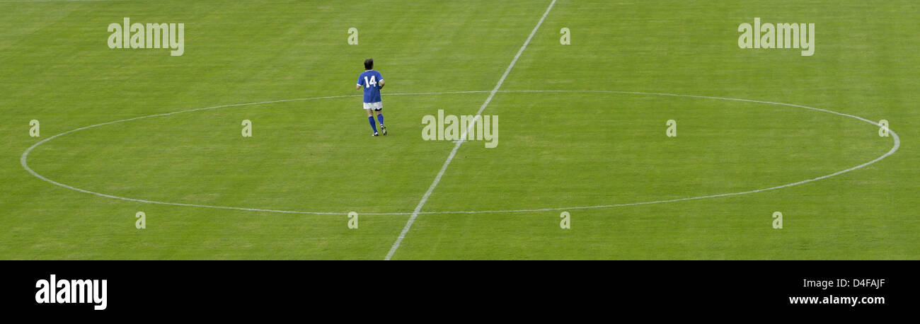 Swiss artist Massimo Furlan wearing the DDR jersey with the number 14 ...