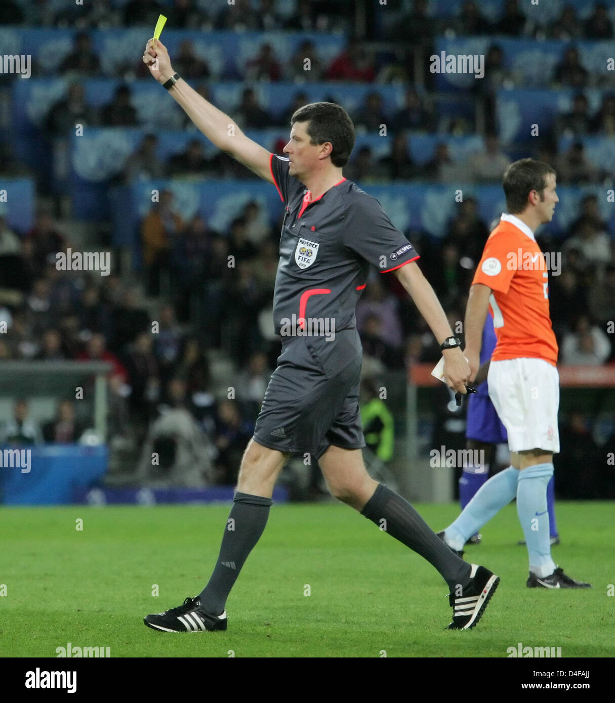 Referee Herbert Fandel shows the yellow card during the UEFA EURO 2008 ...