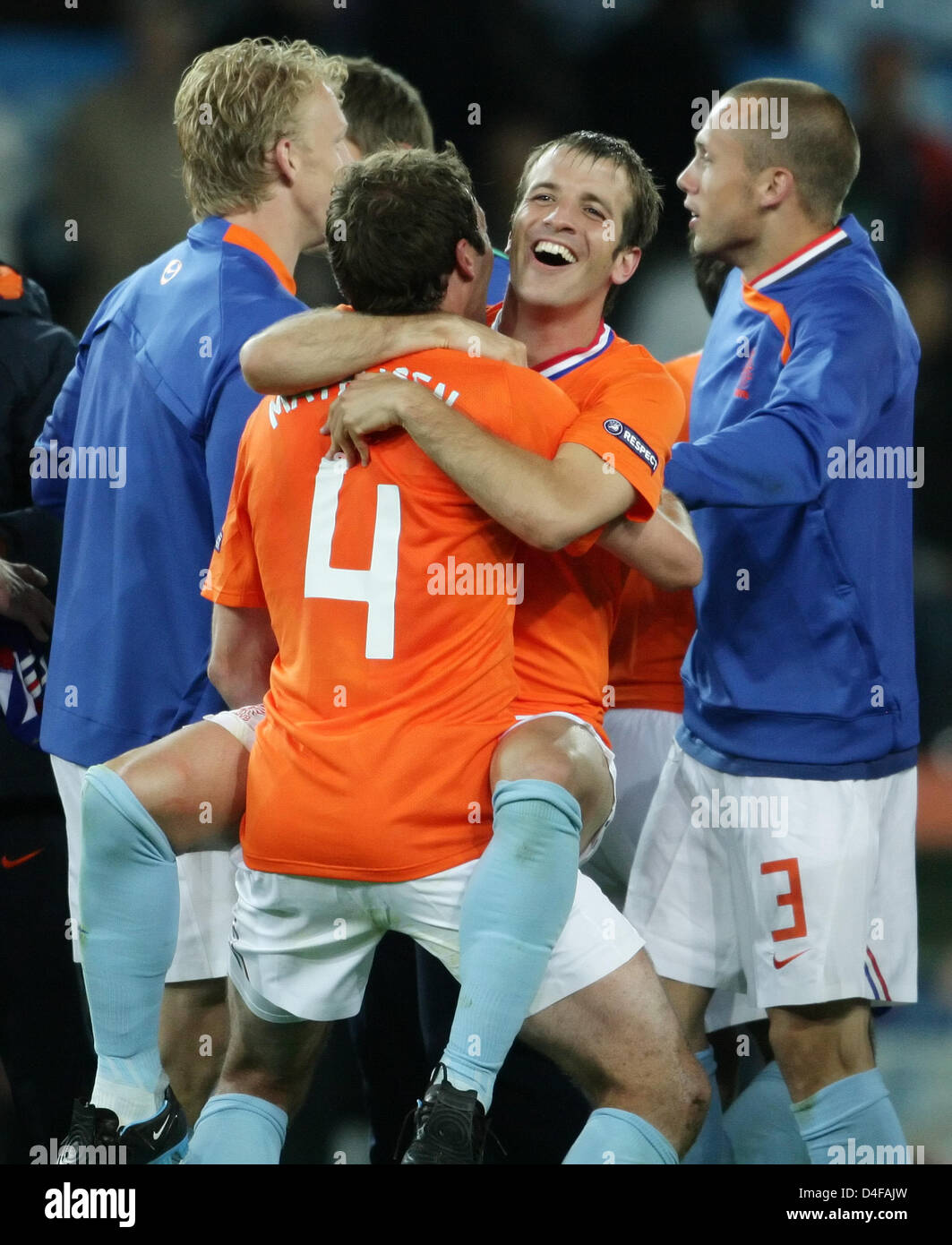 Joris Mathijsen and Rafael van der Vaart (R) of Netherlands jubilates ...