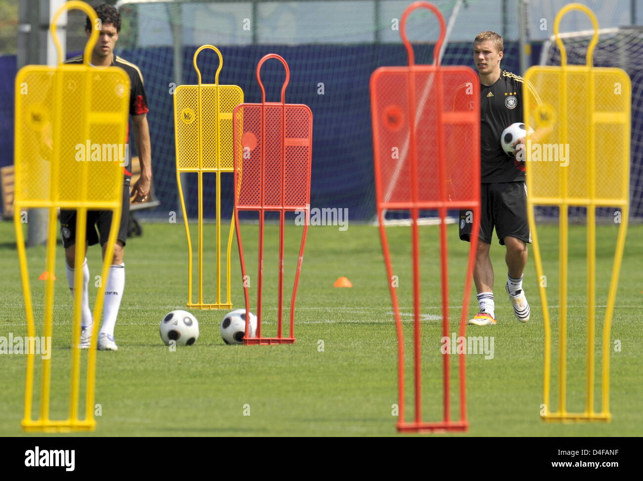 Team-captain Michael Ballack (L) and forward Lukas Podolski during a ...