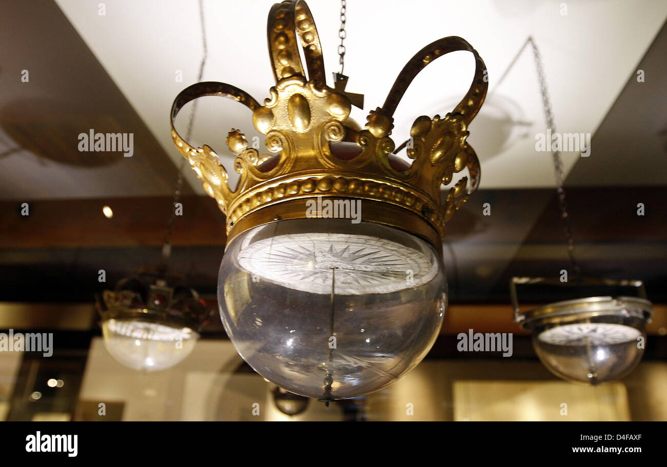 An antique, hanging compass on display at the International Maritime ...