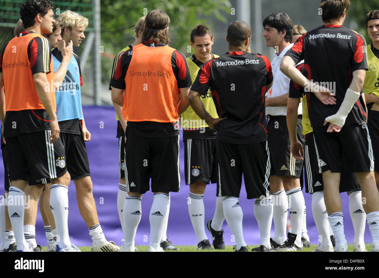 German head coach Joachim Loew (3-R/white shirt) talks to the team ...
