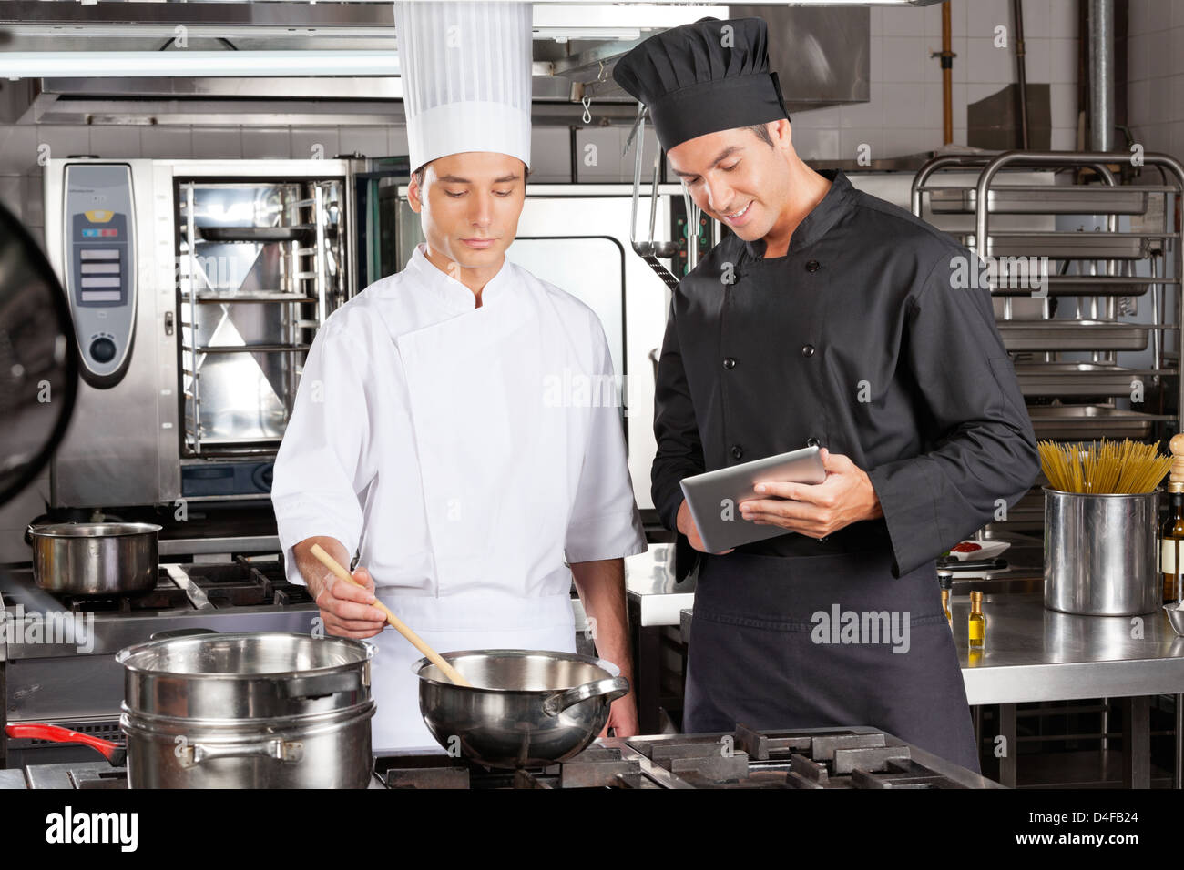 Chefs Preparing Food In Kitchen Stock Photo - Alamy