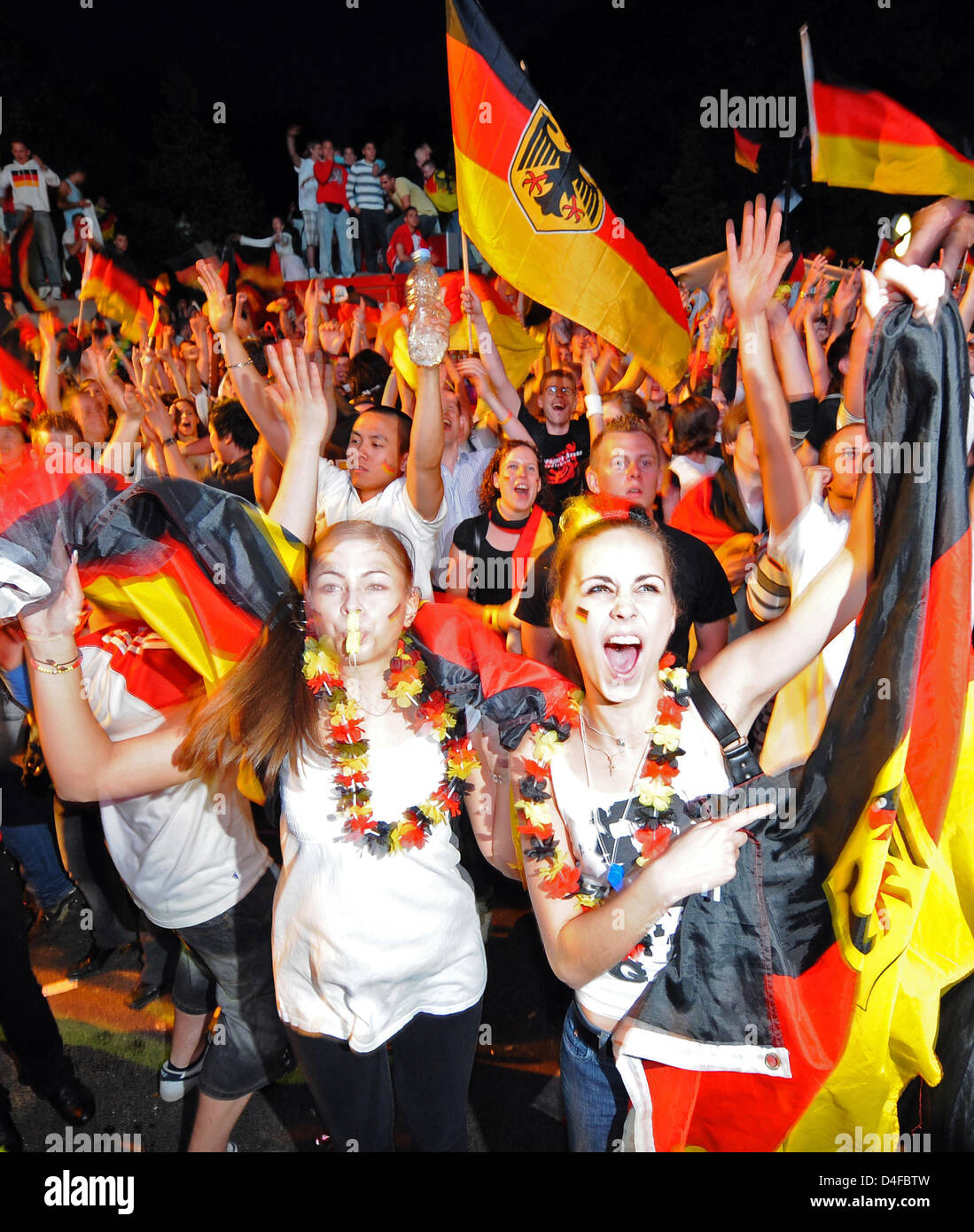 German soccer fans celebrate Germany's 3-2 victory over Turkey in the ...
