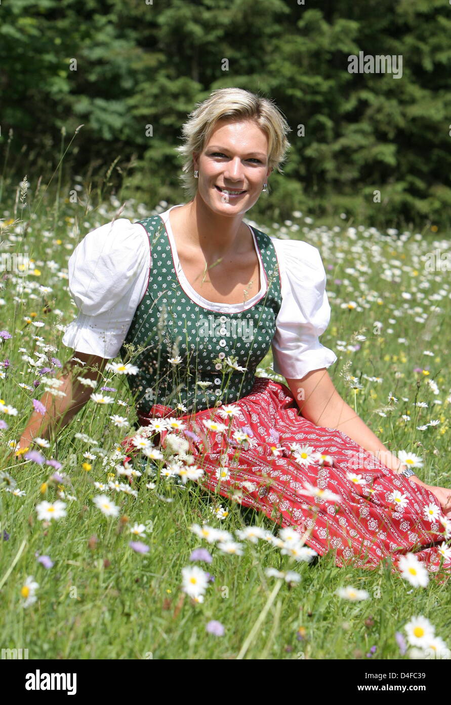 German skier Maria Riesch lingers in a flower meadow near her hometown ...