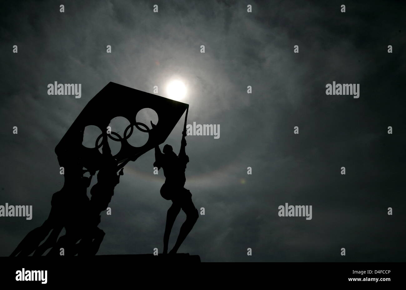 The sculpture of a group holding the Olympic Rings pictured near the ...