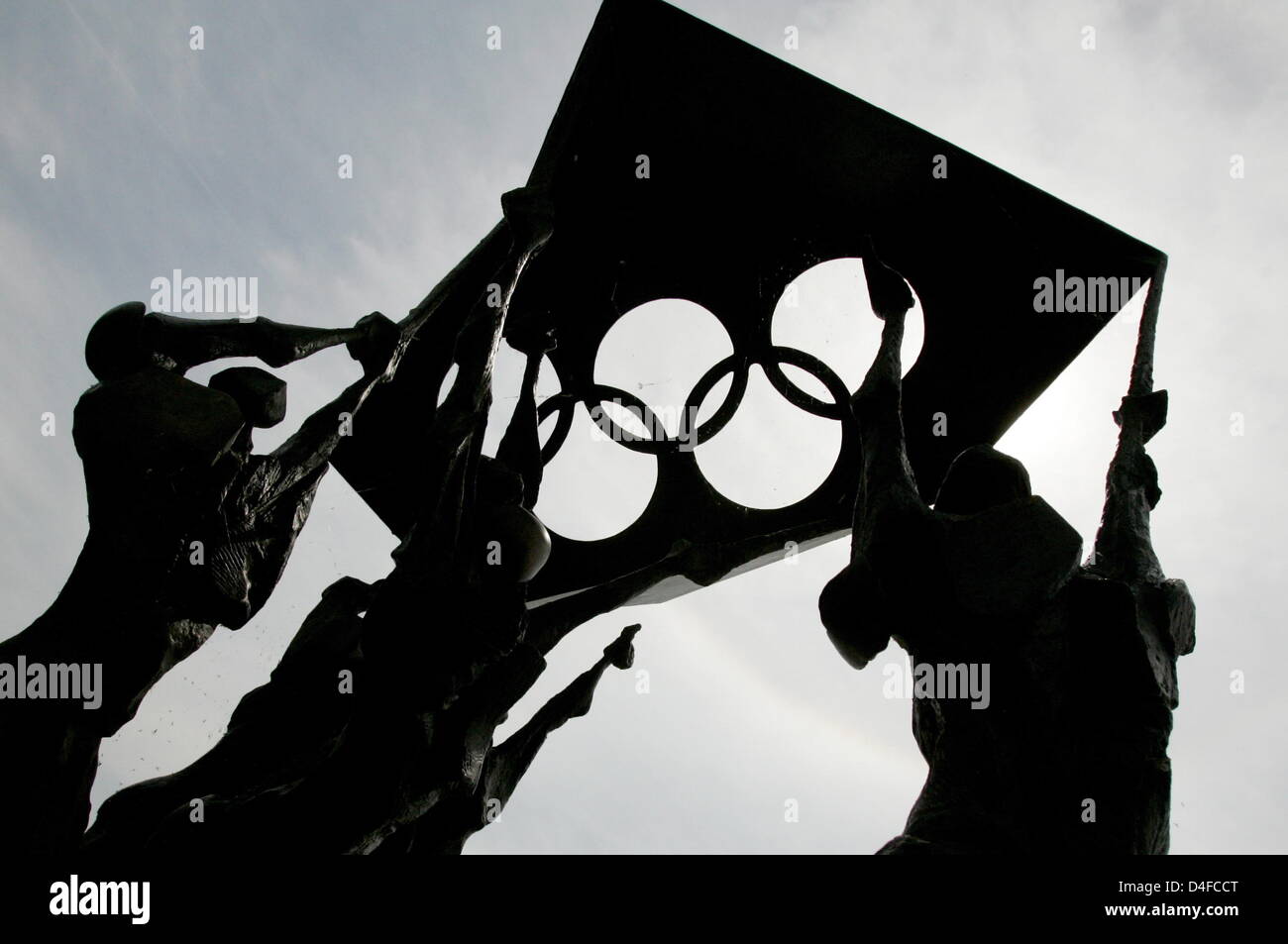 The sculpture of a group holding the Olympic Rings pictured near the ...