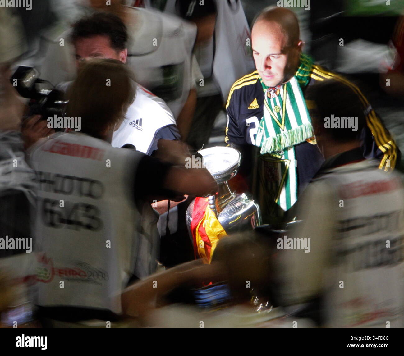 Third goalkeeper Pepe Reina of Spain celebrates with the trophy in his ...