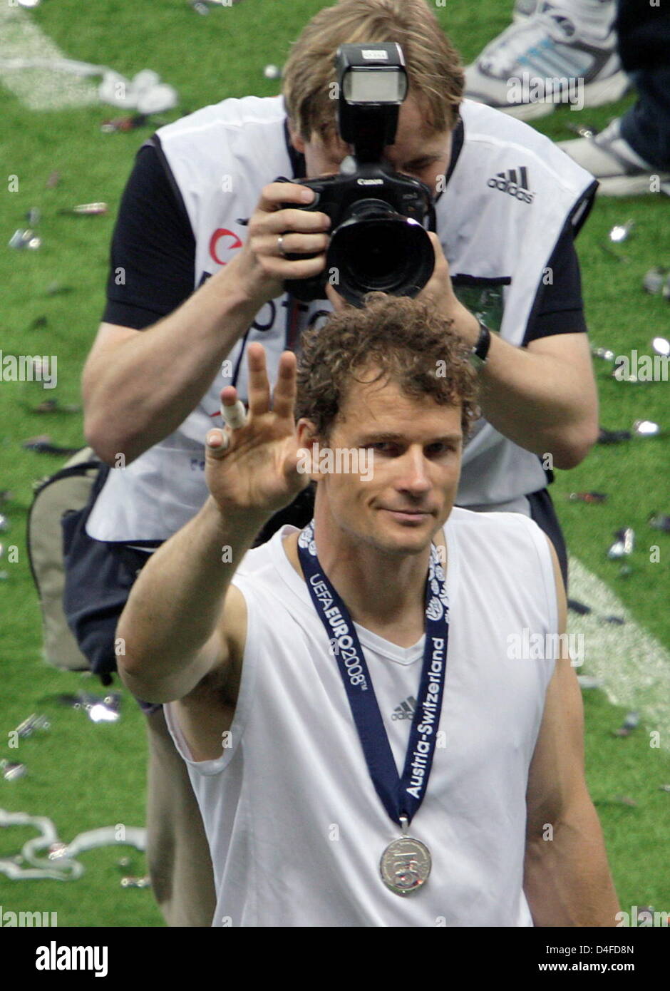 Goalkeeper Jens Lehmann of Germany leaves the pitch waving to the crowd ...