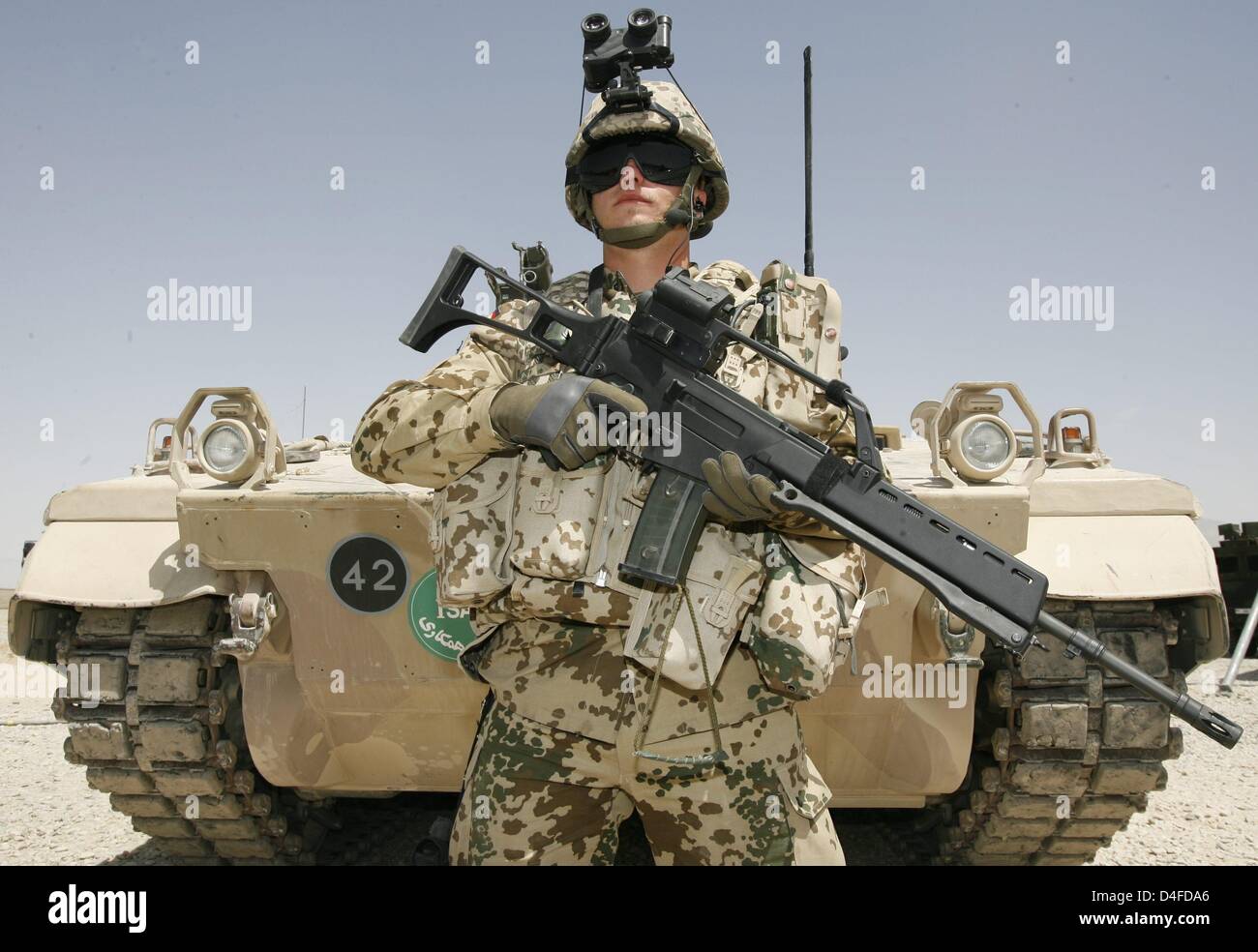 A German Quick Reaction Force (QRF) soldier poses in front of an ...