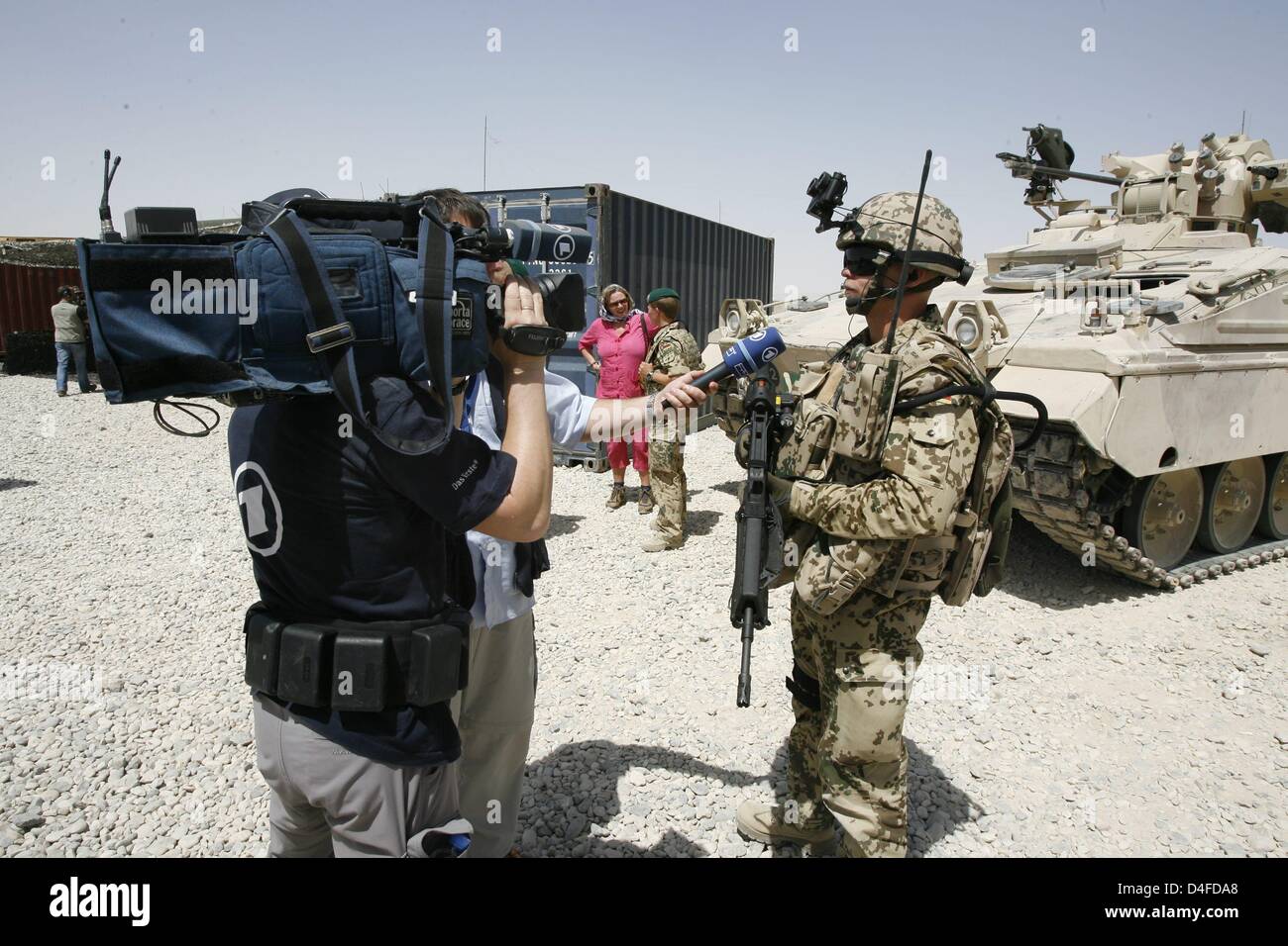 A German Quick Reaction Force (QRF) soldier gives an interview in front ...