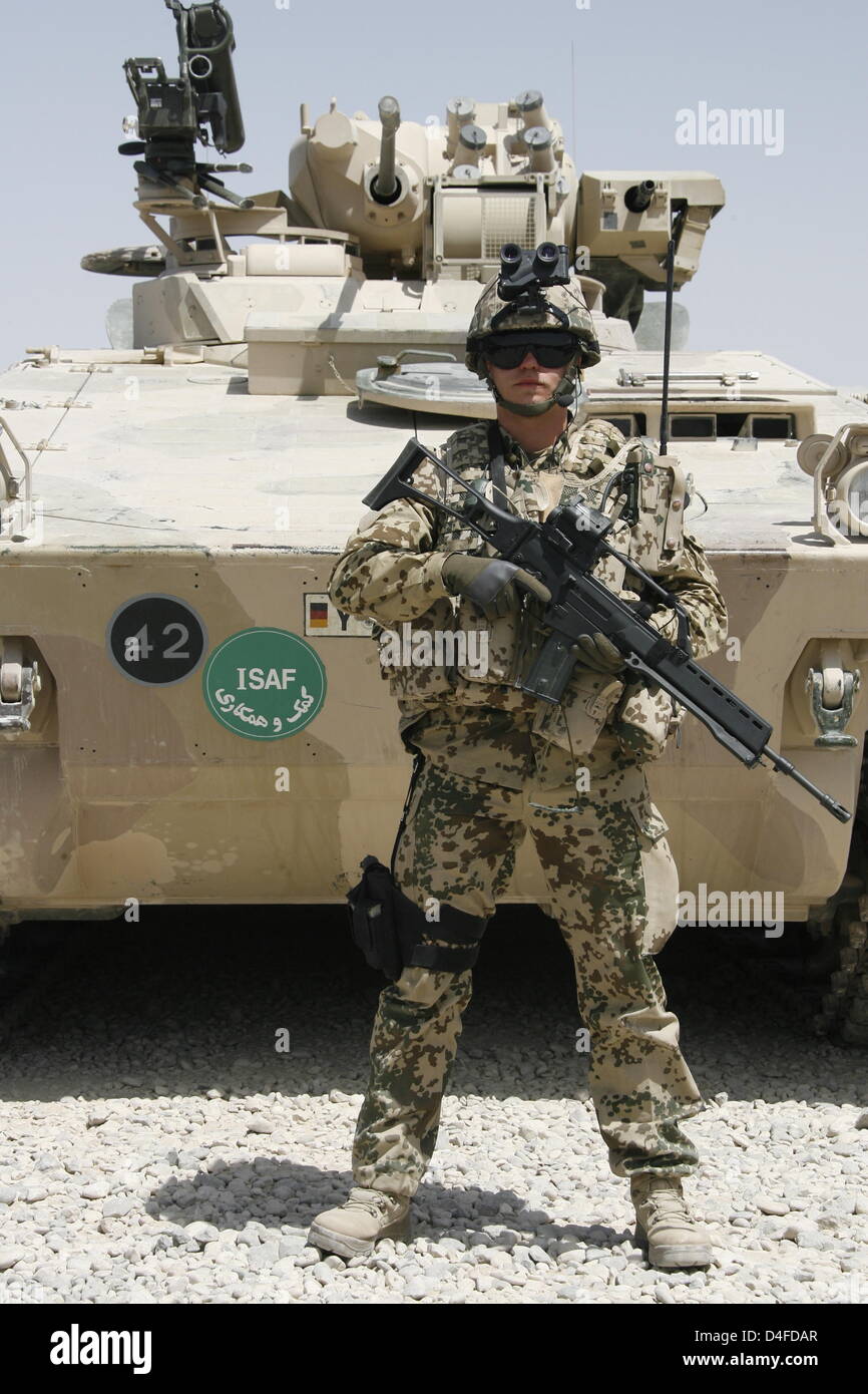 A German Quick Reaction Force (QRF) soldier poses in front of an ...
