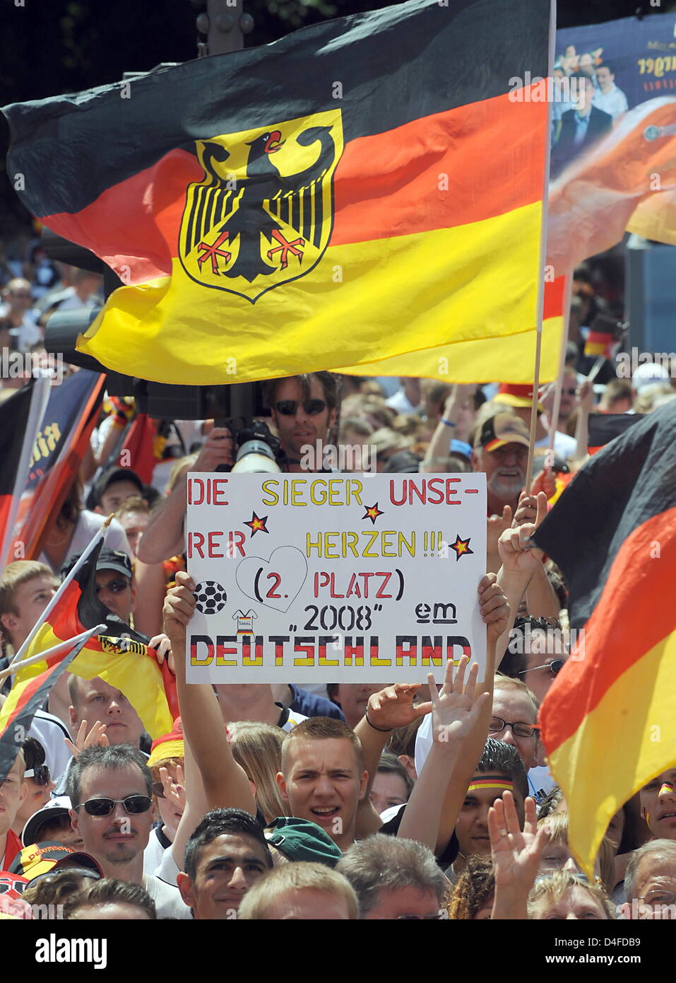German soccer fans celebrate on the streets near Brandenburg Gate in ...