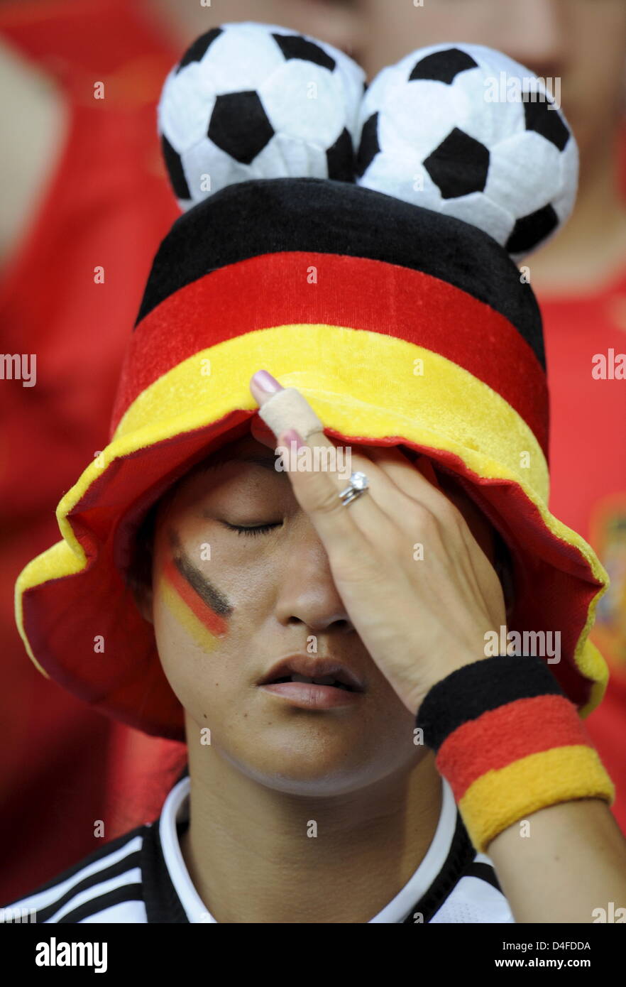 A fan of the German soccer team watches the UEFA EURO 2008 final match ...