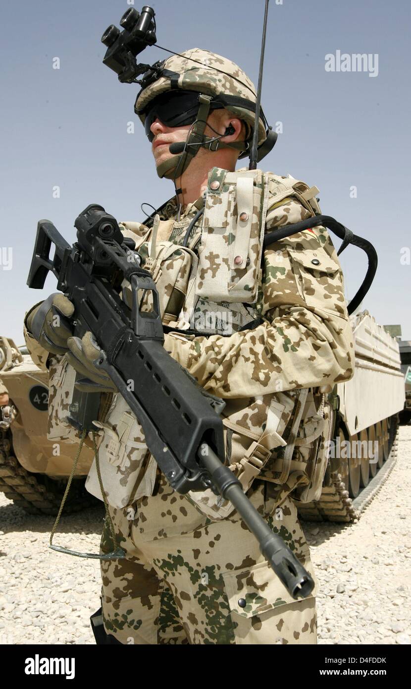 A German Quick Reaction Force (QRF) soldier poses in front of an ...
