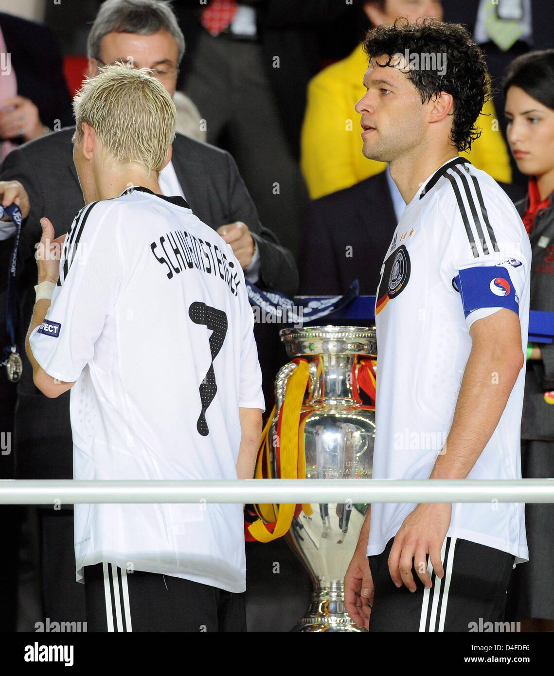 German players Bastian Schweinsteiger (L-R) and Michael Ballack walk ...