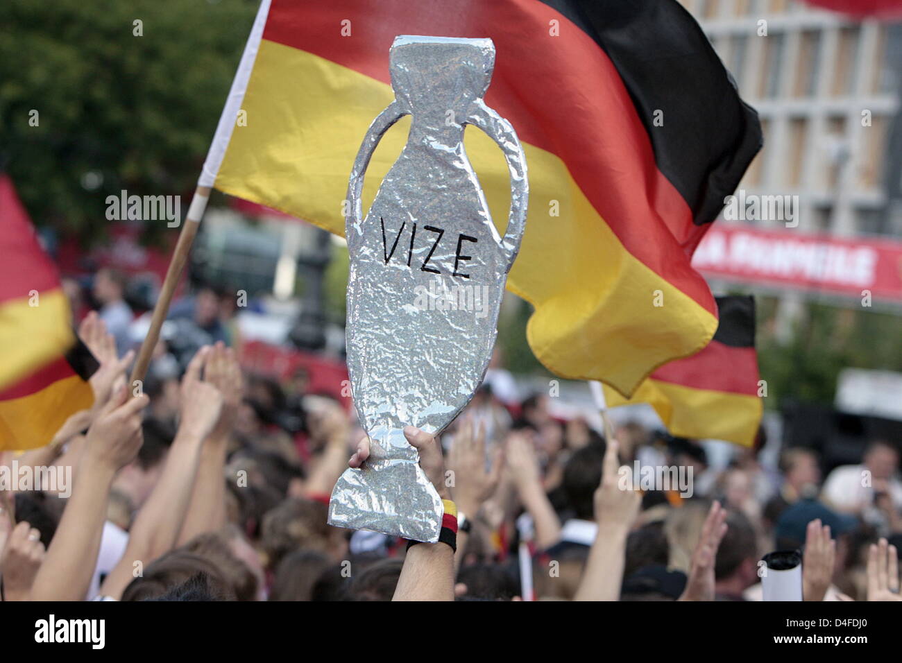 German soccer fans celebrate during the team reception in front of ...