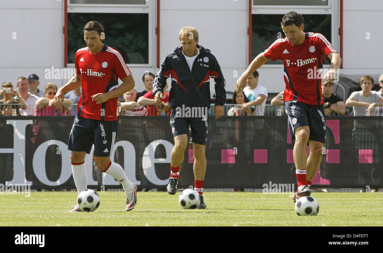 FC Bayern Munich's new head coach Juergen Klinsmann (C)and his players ...