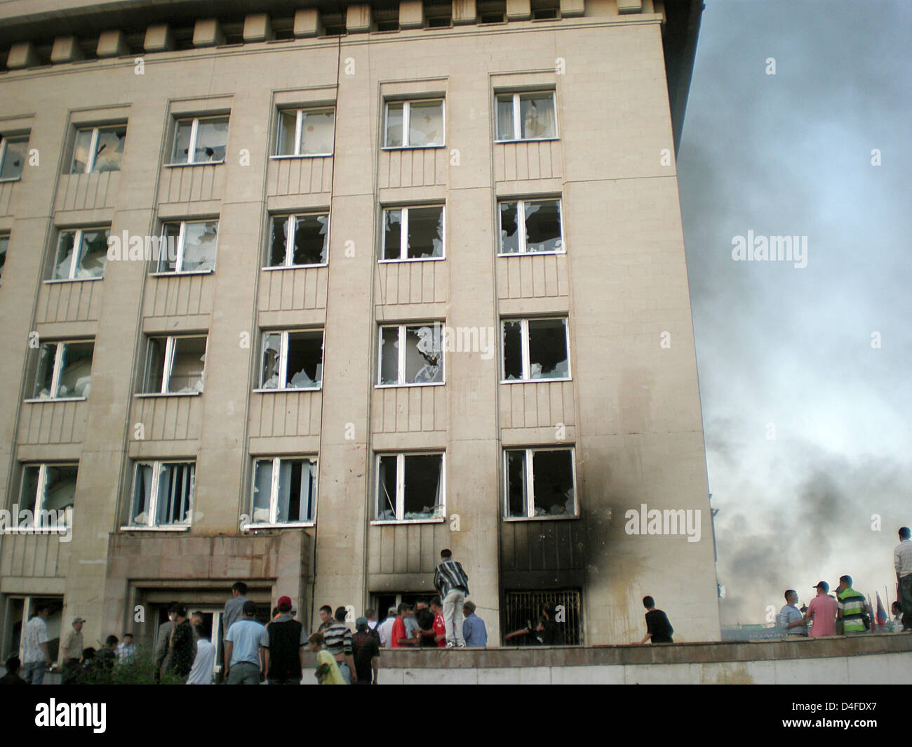 Smoke rises from a party building of the Mongolian People's ...