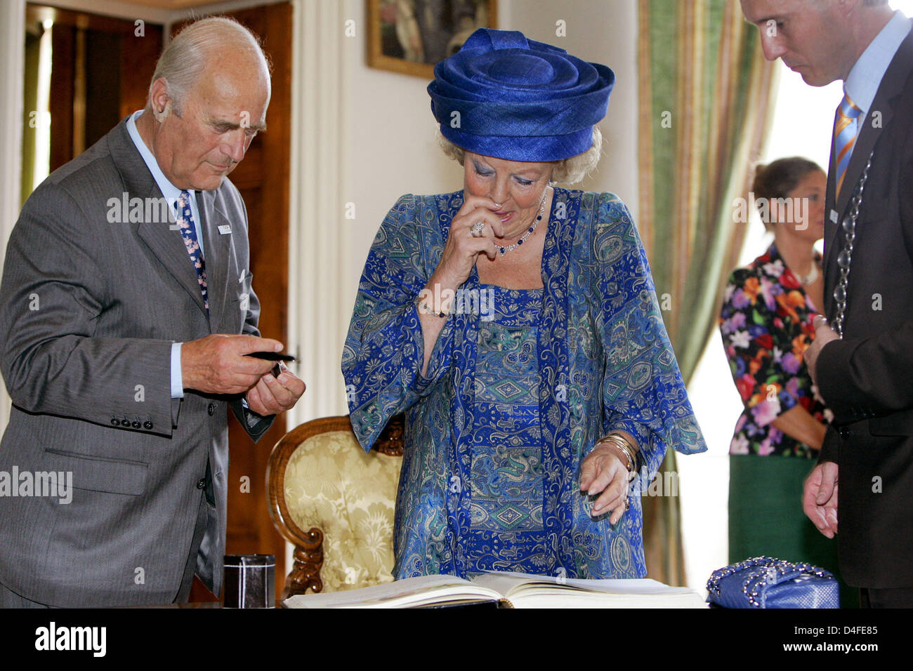 Queen Beatrix of the Netherlands signs the golden book of Bad Arolsen ...