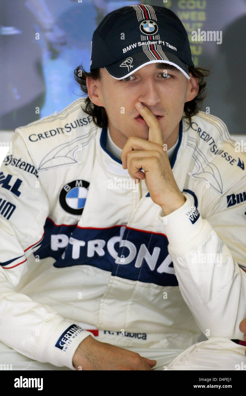 Polish Formula One driver Robert Kubica of BMW Sauber sits in his pit ...