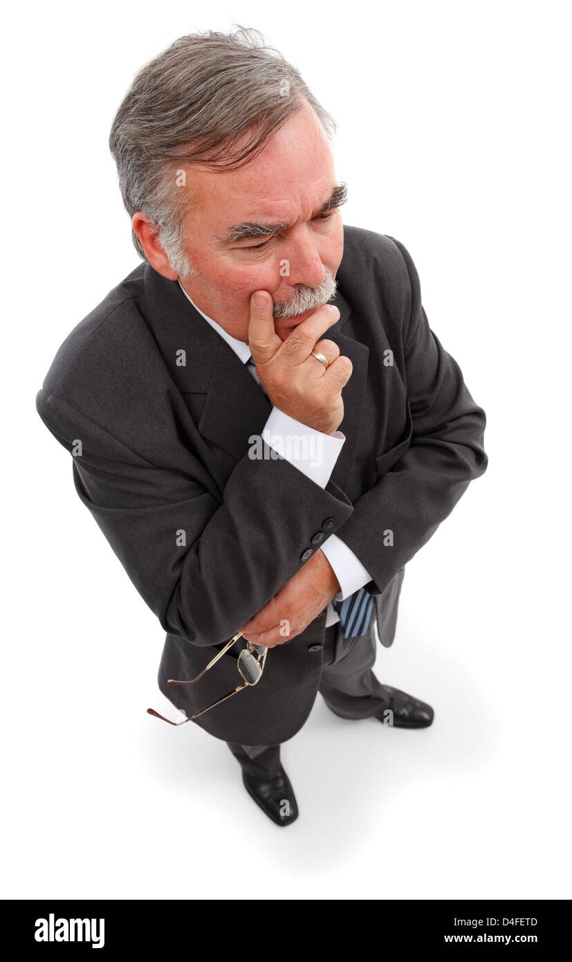 Thoughtful man's gesture while thinking and holding his glasses Stock ...