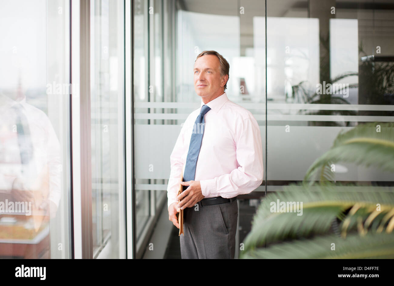 Standing at a window hi-res stock photography and images - Alamy