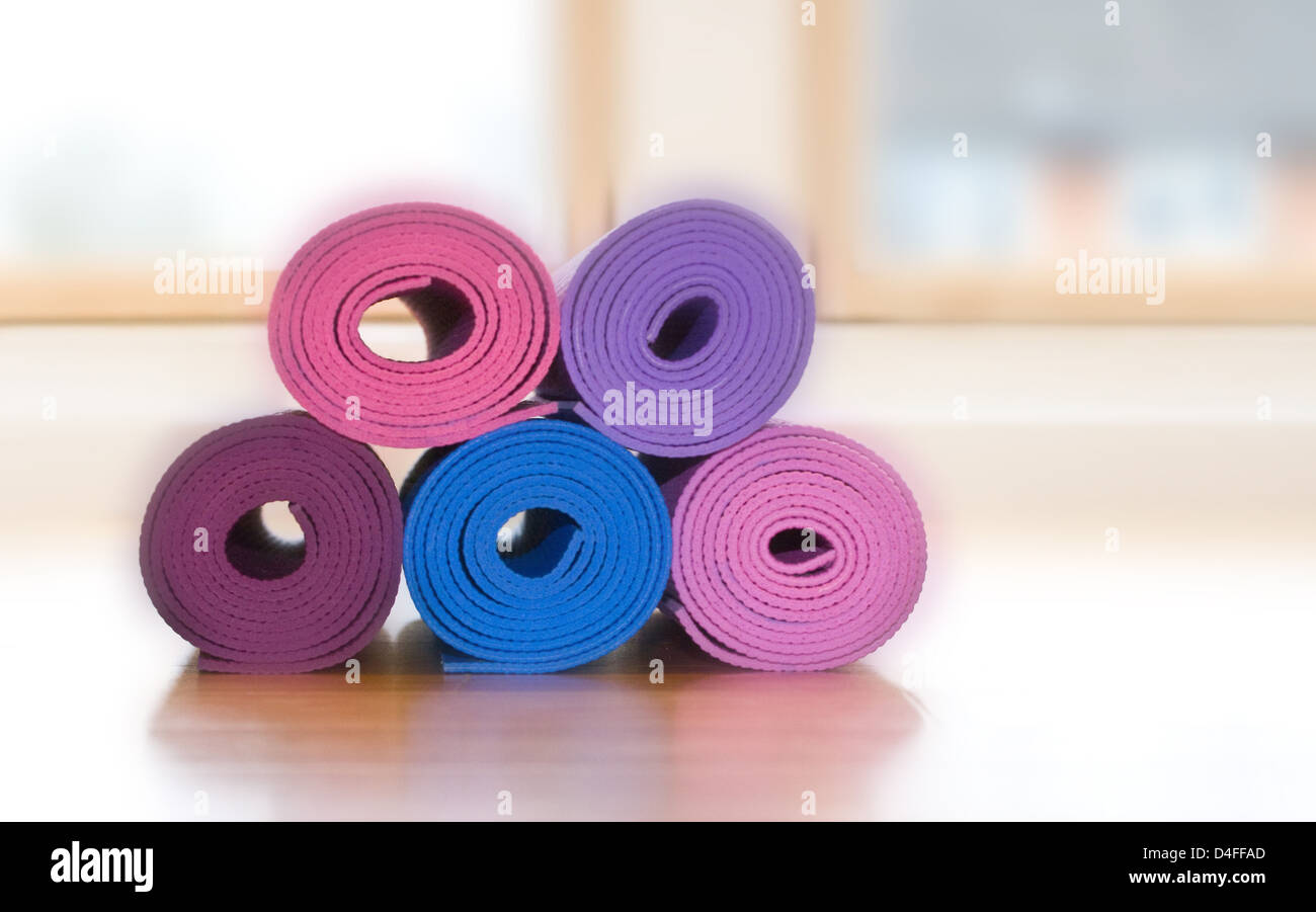 Yoga Mats rolled up in a Yoga Studio Stock Photo - Alamy