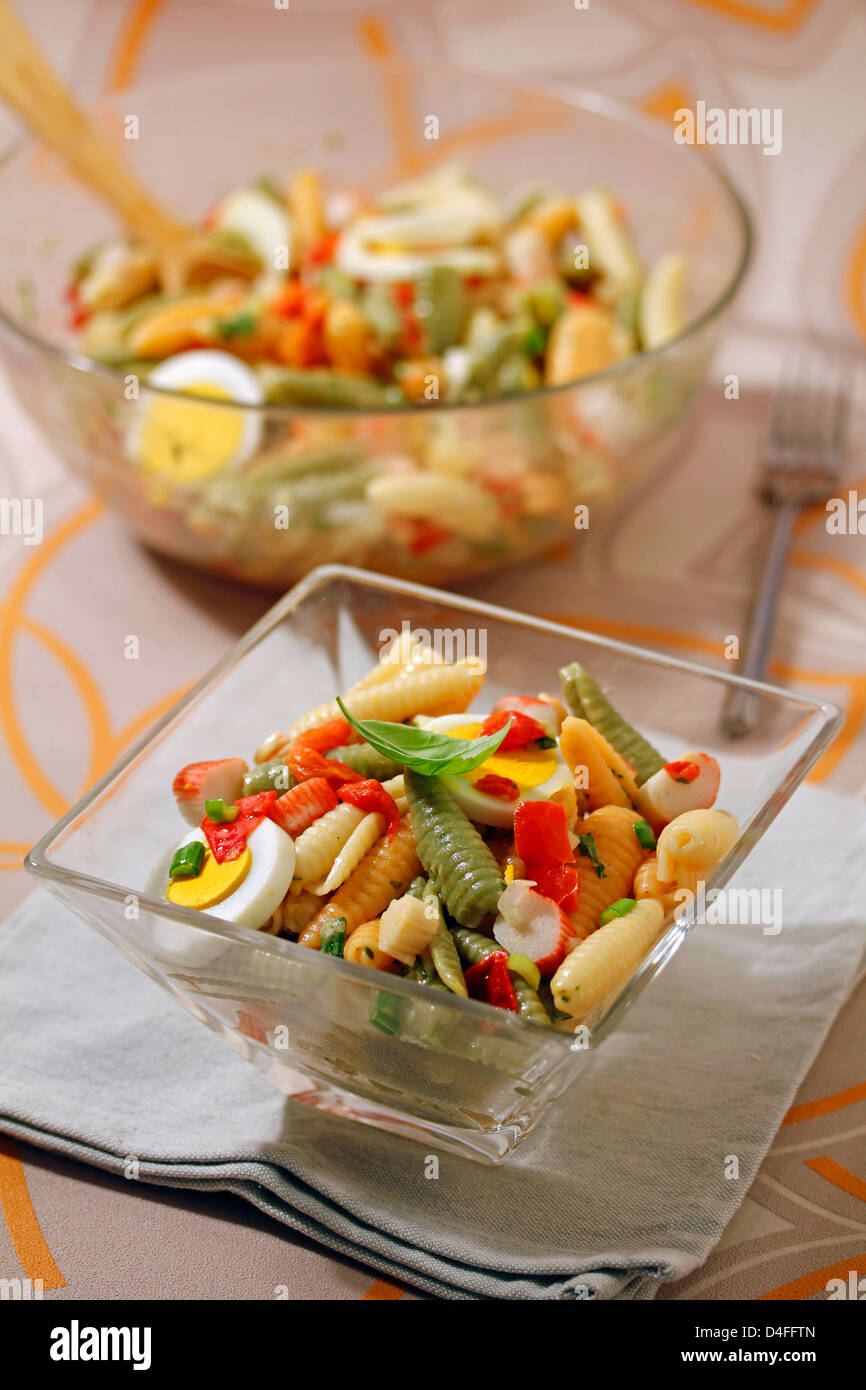 Pasta shells with basil sauce. Recipe available Stock Photo - Alamy