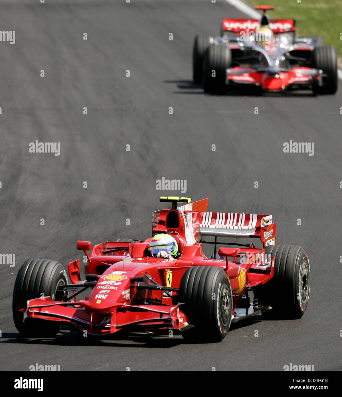 Brazilian Formula One driver Felipe Massa of Ferrari (L) steers his car ...